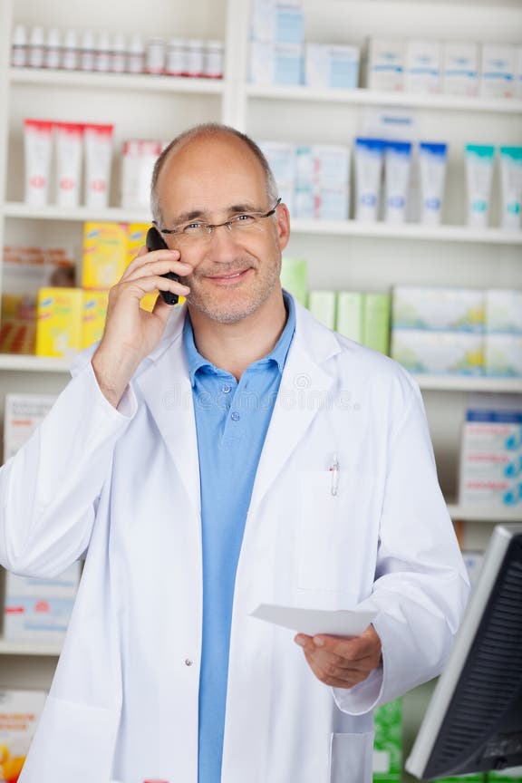 Confident Pharmacist Calling Stock Photo - Image of cordless ...