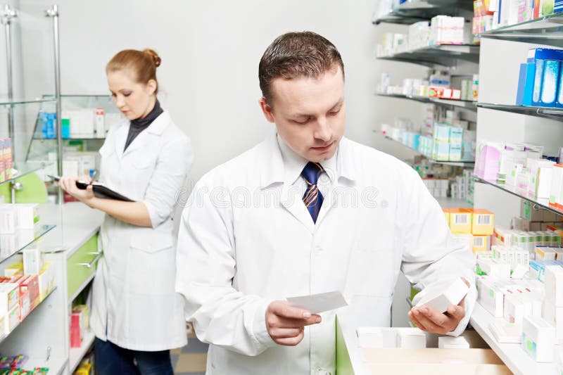 Confident Pharmacy Chemist Man in Drugstore Stock Image - Image of ...