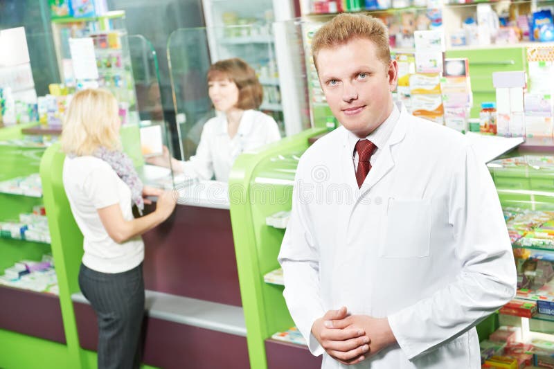 Confident Pharmacy Chemist Man in Drugstore Stock Photo - Image of ...