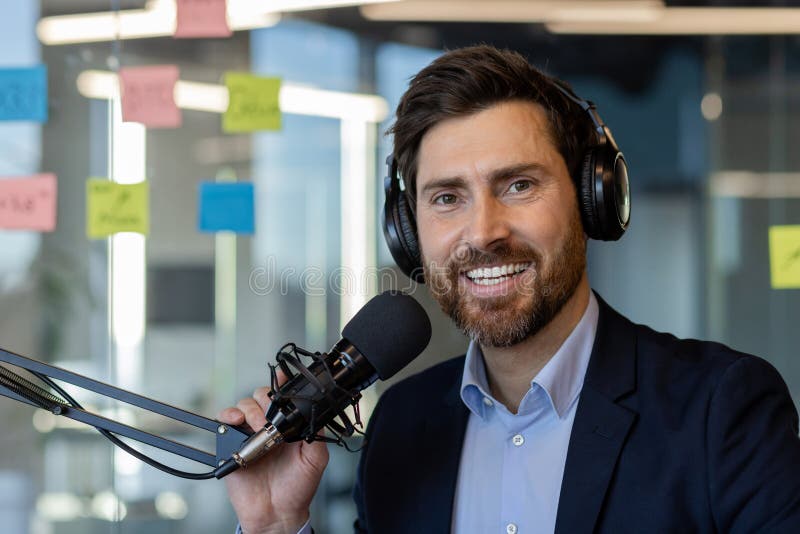 Confident Podcast Host Wearing Headphones while Recording in Office ...
