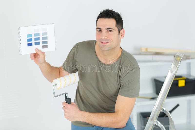 Confident Professional Painter Showing Color Swatches Stock Image ...