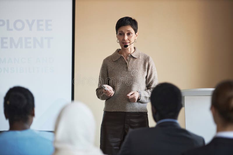 Confident Professional Standing in Front of Audience during ...