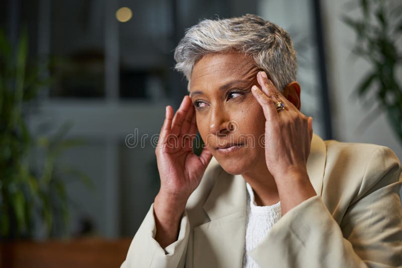 Confident Professional Woman in Office Setting Pondering a Complex Task ...