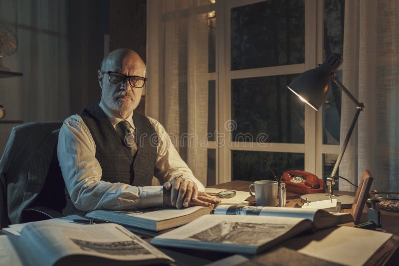 Professor Sitting at Desk Using His Laptop Stock Image - Image of notes ...