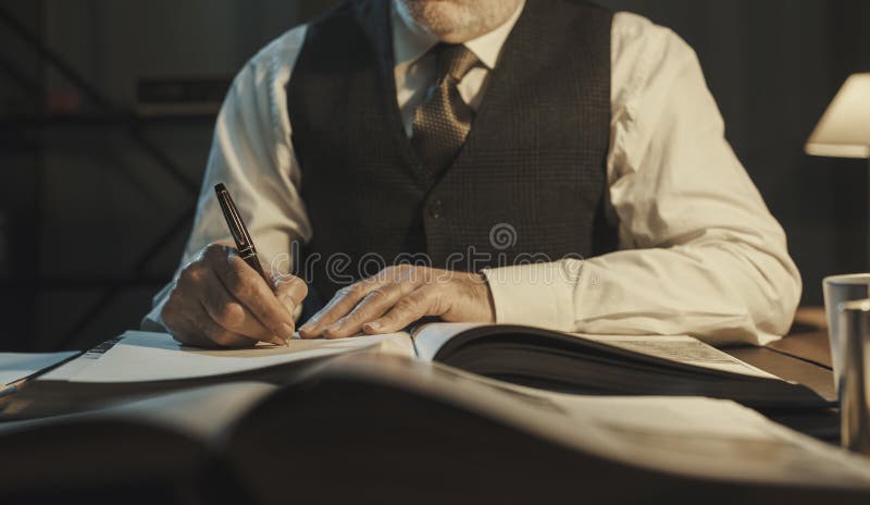 Academic Professor Writing Down Notes and Reading a Book Stock Image ...