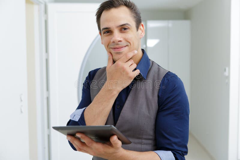 Confident Real Estate Agent Holding Tablet Stock Photo - Image of ...