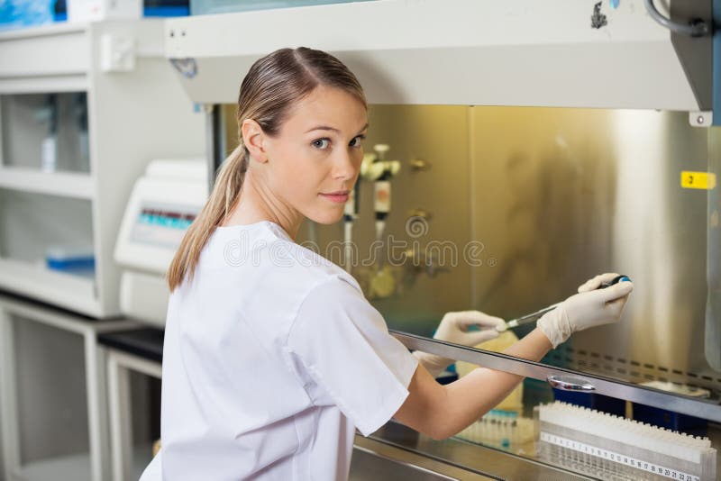 Confident Researcher Experimenting in Laboratory Stock Photo - Image of ...