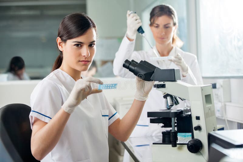 Confident Researcher Using Microscope in Lab Stock Photo - Image of ...