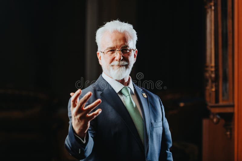 Confident 60s University Rector Leads the Faculty with Years of ...