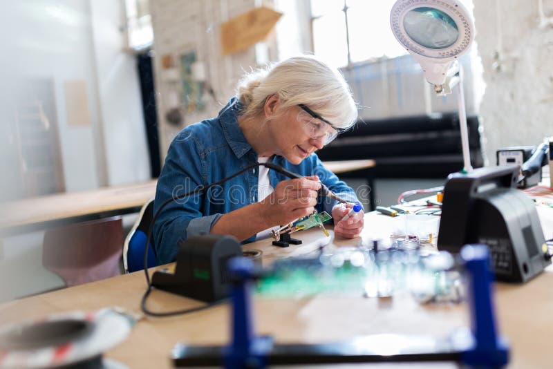 Senior Woman in Electronics Workshop Stock Image - Image of business ...