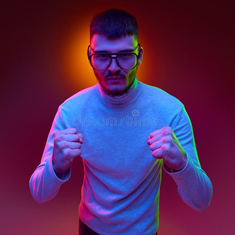 Confident Serious Young Bearded Man Dressed Casually With Glasses