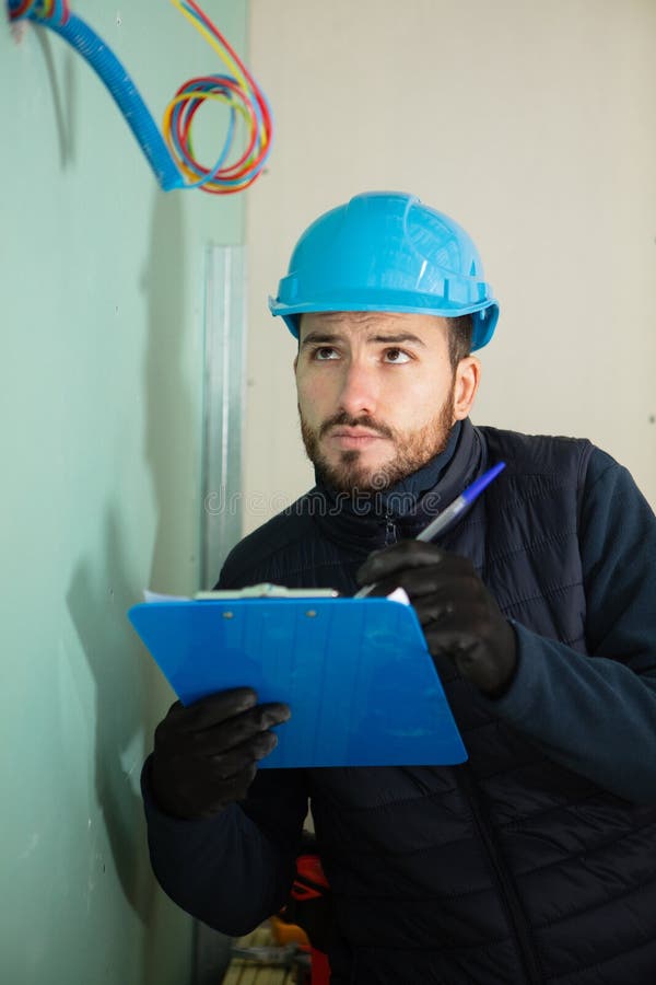Confident Service Man Taking Notes Stock Photo - Image of contractor ...