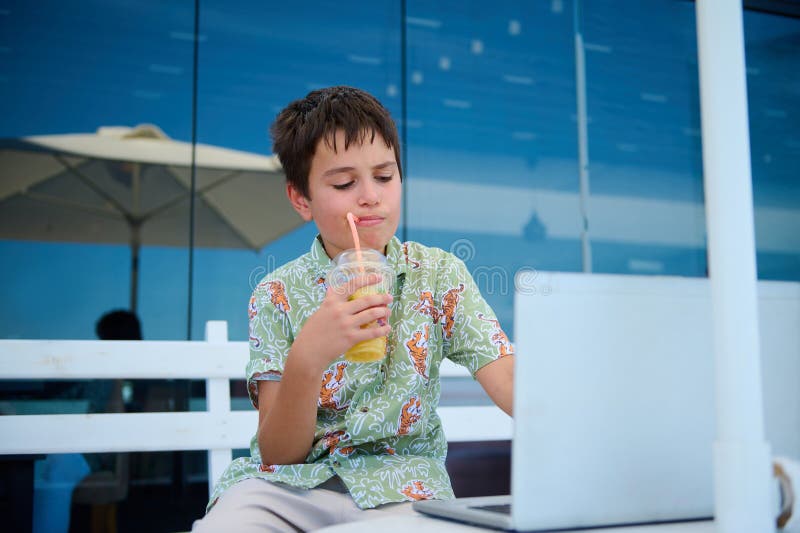 Confident Smart Elementary Age Student Boy Drinking Juice and Doing ...