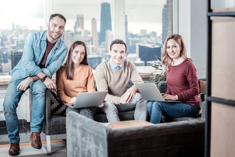 Confident Smart Workers Looking Straight and Working with Laptops ...