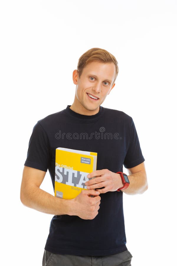 Confident Smart Young Man Holding His Manual Stock Photo - Image of ...
