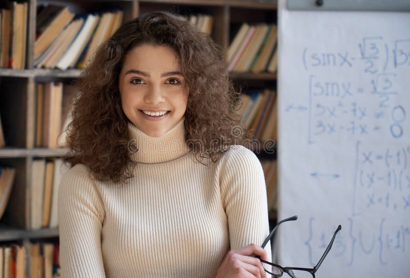Confident Smiling Hispanic Woman Teacher Looking Camera Classroom Stock