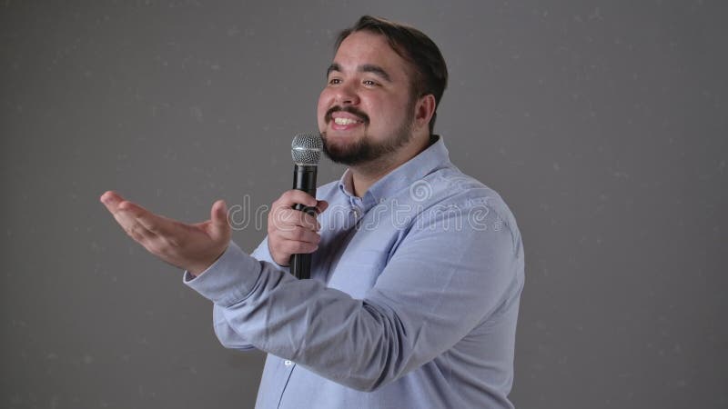 Speaker Engaging Audience with Microphone Presentation Gesture Stock ...