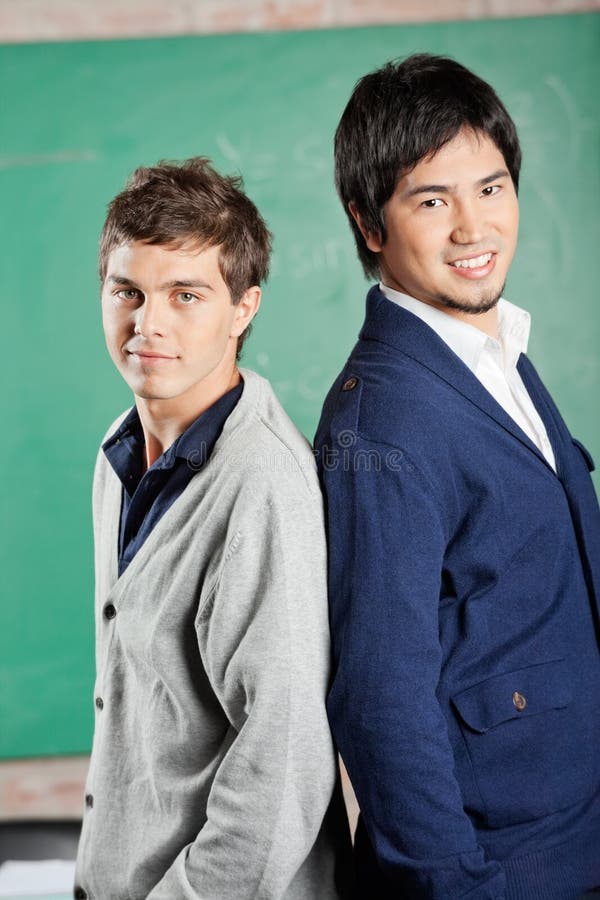 Confident Students Standing in Classroom Stock Image - Image of ...