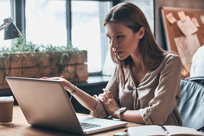 Confident and Successful. Concentrated Young Woman Using Compute Stock ...