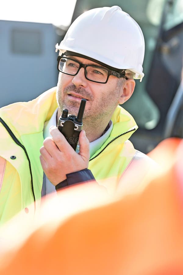 Confident Supervisor Using Walkie-talkie at Construction Site Stock ...