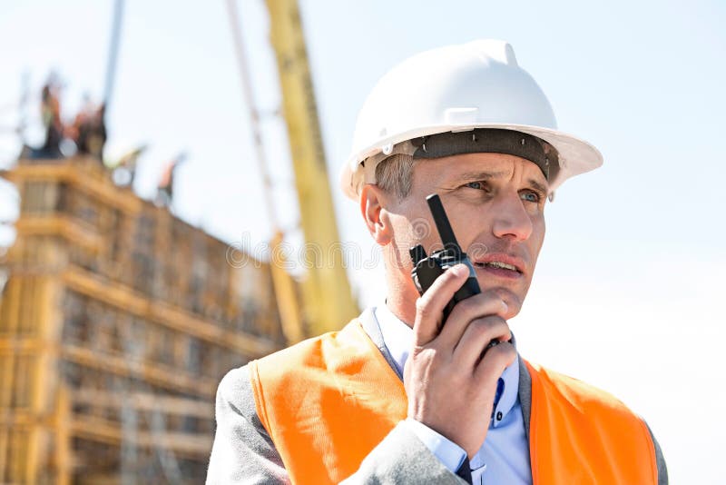 Confident Supervisor Using Walkie-talkie at Construction Site Stock ...