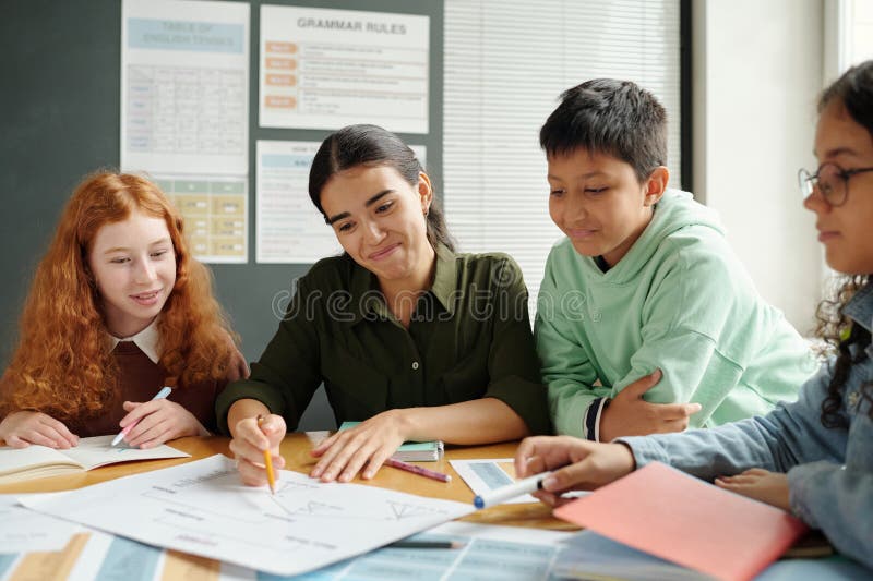 Confident Teacher of English Language Pointing at Document with Rules ...