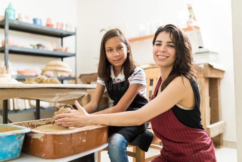 Confident Teacher and Girl Practicing Pottery in Workshop Stock Photo ...
