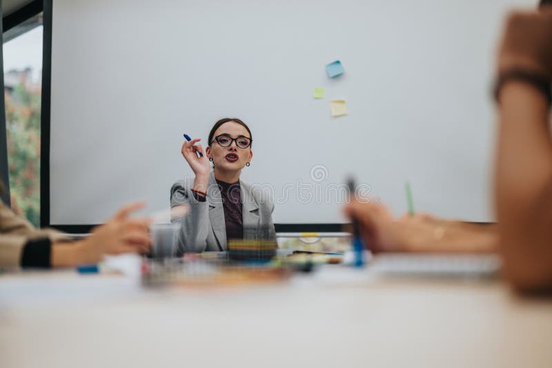 Confident Teacher Leading Engaging Classroom Discussion with Students ...