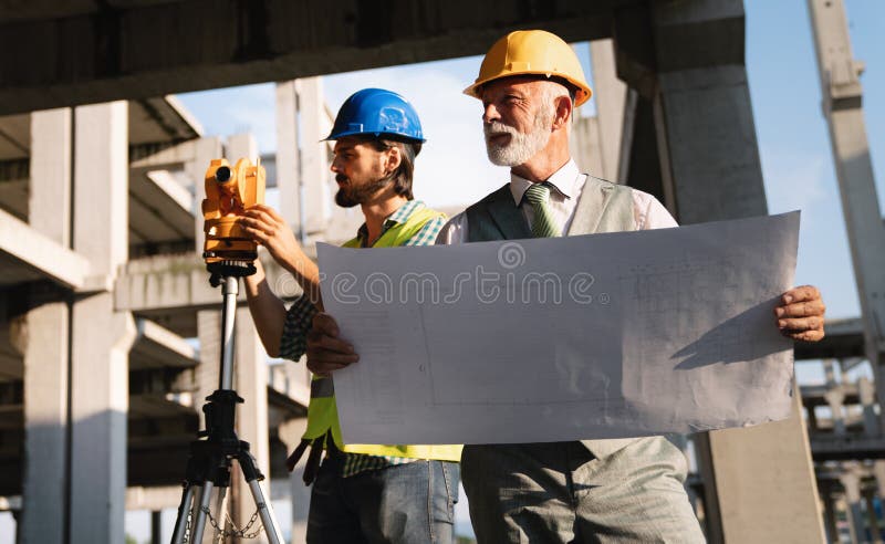 Confident Team of Architects and Engineers Working Together on ...