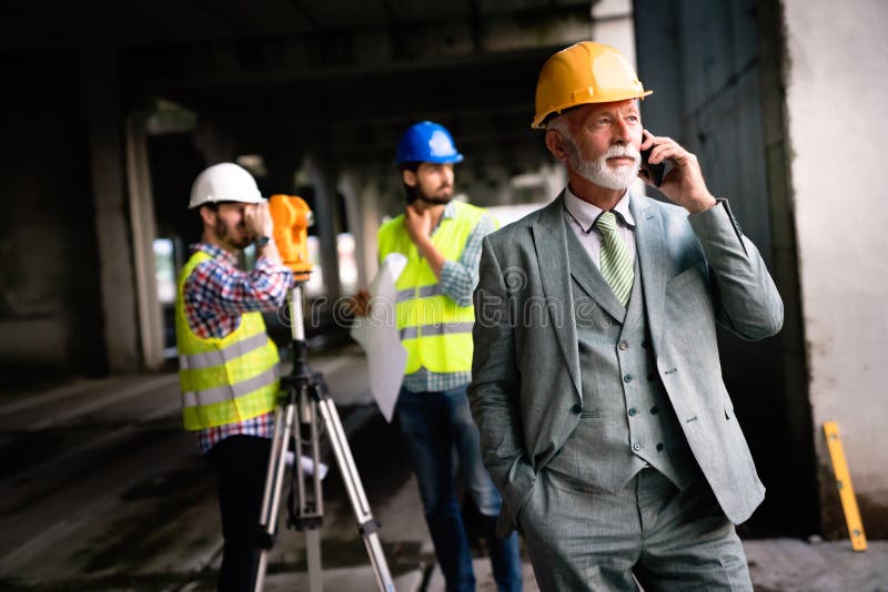 Confident Team of Architects and Engineers Working Together on ...