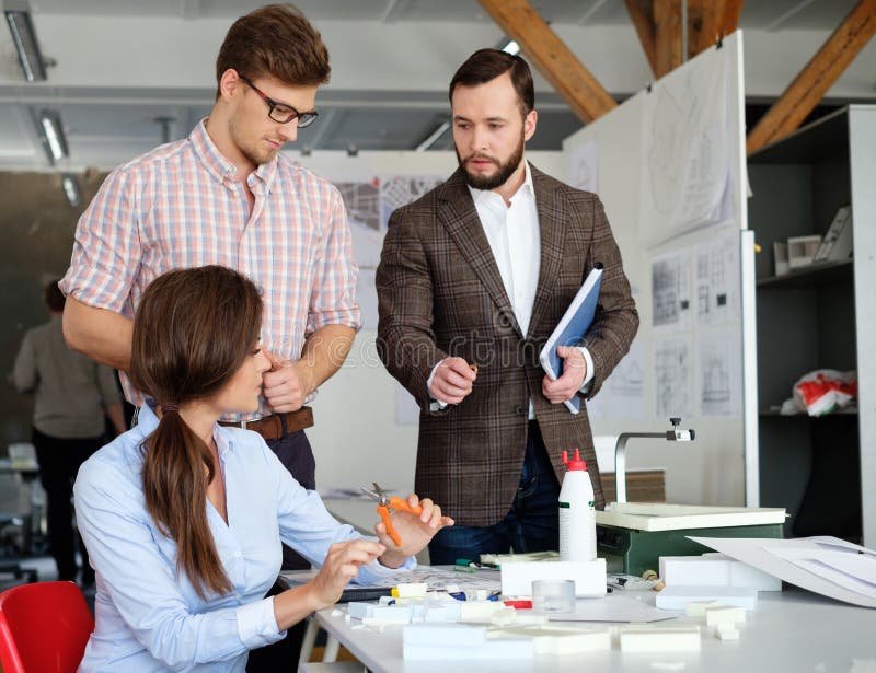 Confident Team of Engineers Working Together in a Architect Studio ...