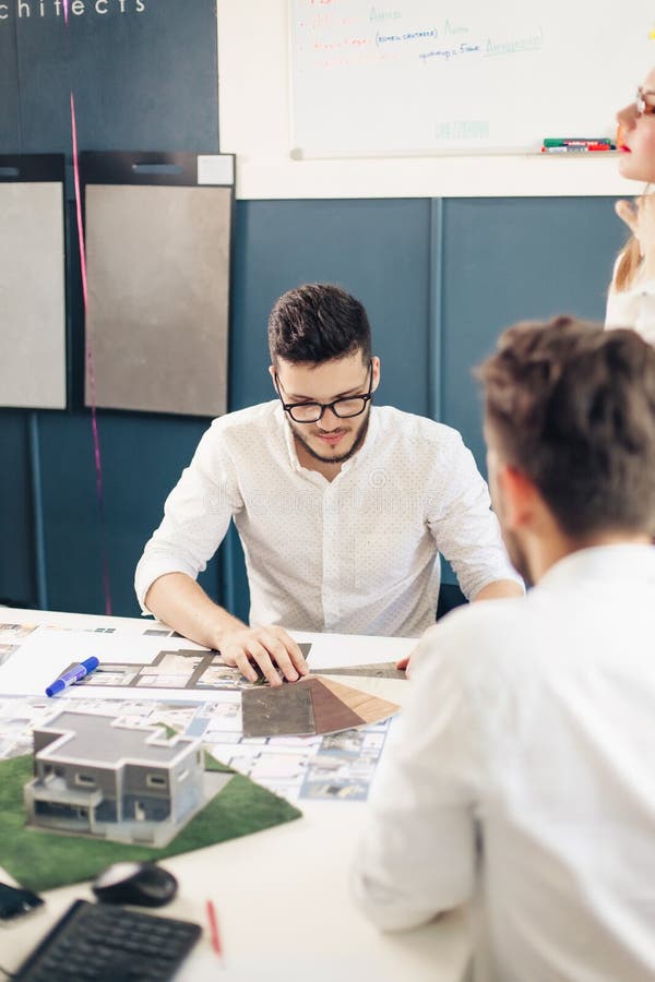 Confident Team of Engineers Working Together in a Architect Studio ...