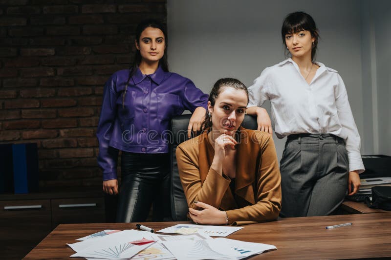 Confident Team of Three Professionals Collaborating in a Modern Office ...
