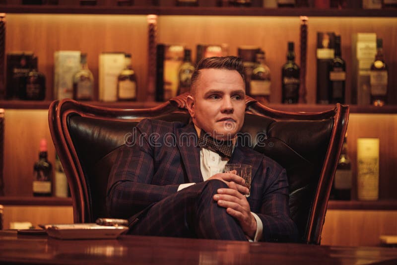 Confident Upper Class Man Smoking Cigar In Gentlemen`s Club Stock Photo ...