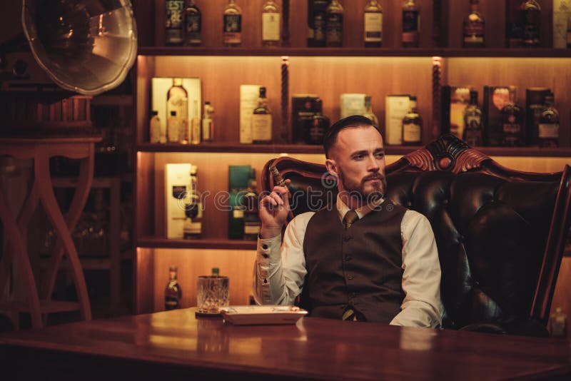 Confident Upper Class Man Smoking Cigar in Gentlemen`s Club Stock Photo ...