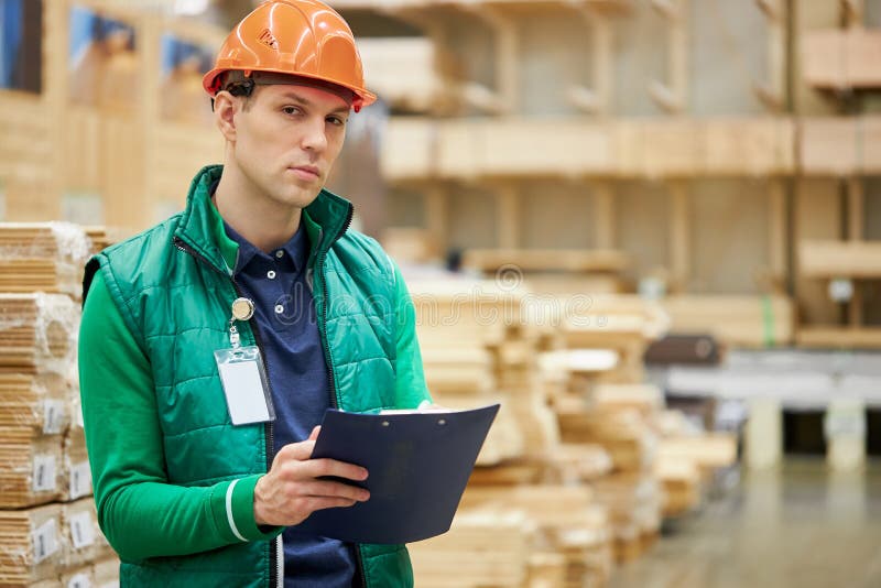 Confident Warehouse Worker Write the Number of Boards in Document Stock ...