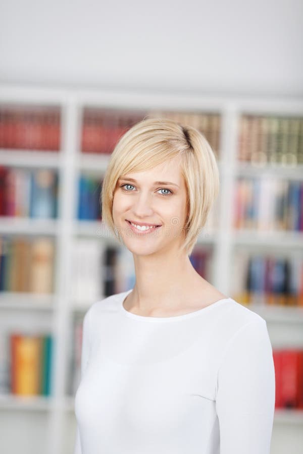 Confident Woman Standing in Library Stock Photo - Image of happiness ...