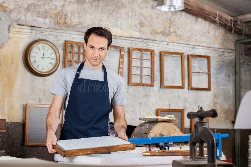 Confident Worker Holding Mold at Paper Factory Stock Photo - Image of ...
