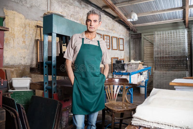 Confident Worker Standing with Hands in Pockets at Factory Stock Photo ...