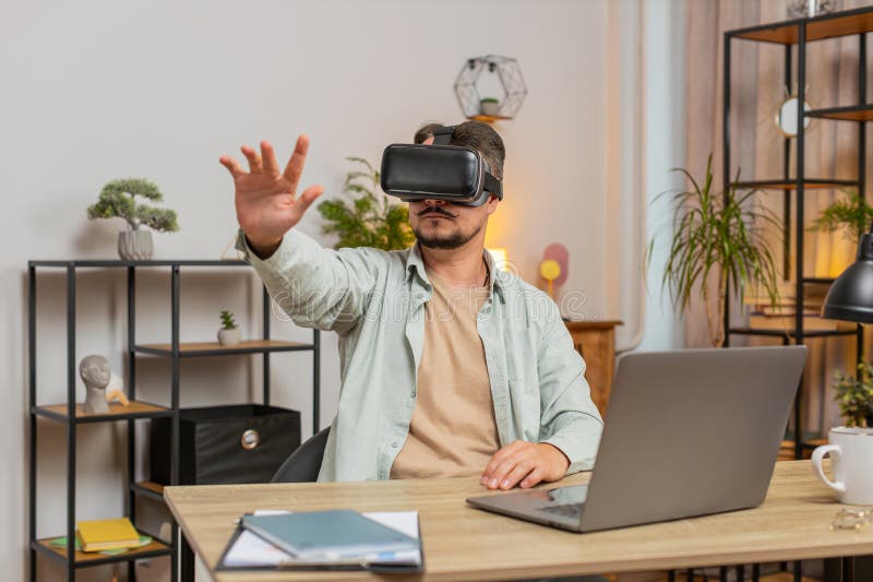 Confident Young Caucasian Man Freelancer Using VR Headset while Sitting ...