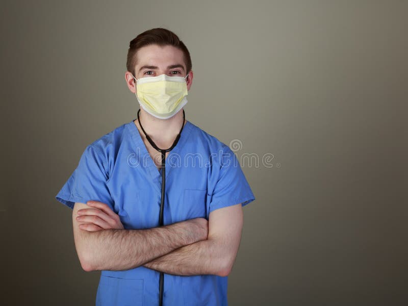 Confident Young Doctor in Scrubs Stock Photo - Image of adult ...
