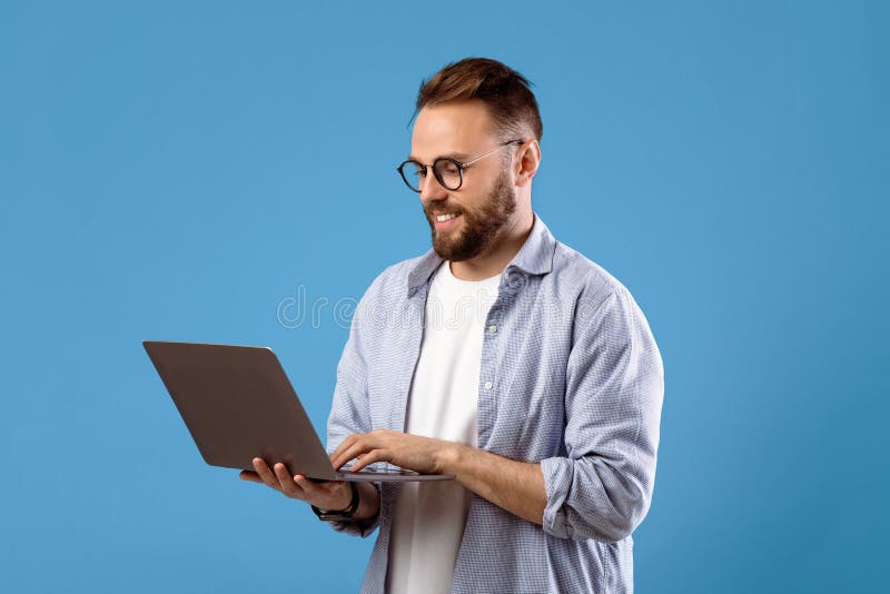 Confident Young Guy in Glasses Using Laptop Pc for Online Work or ...