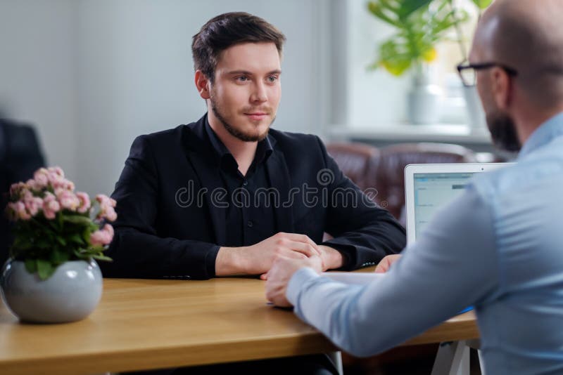 Confident Young Man Attending Job Interview Stock Photo - Image of ...