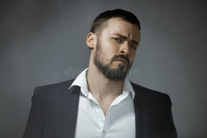 Serious Businessman with Intense Expression in Formal Suit Stock Photo ...