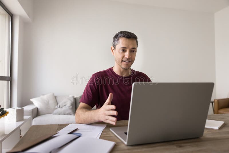 Confident Young Man Freelancer Speak Looking on Notebook Screen Stock ...