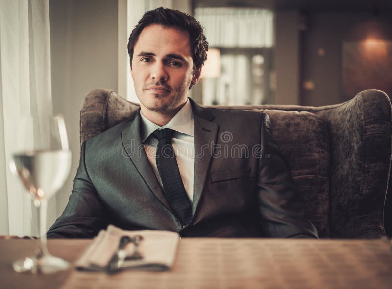 Confident Young Man Sitting in Restaurant Waiting for Somebody Stock ...