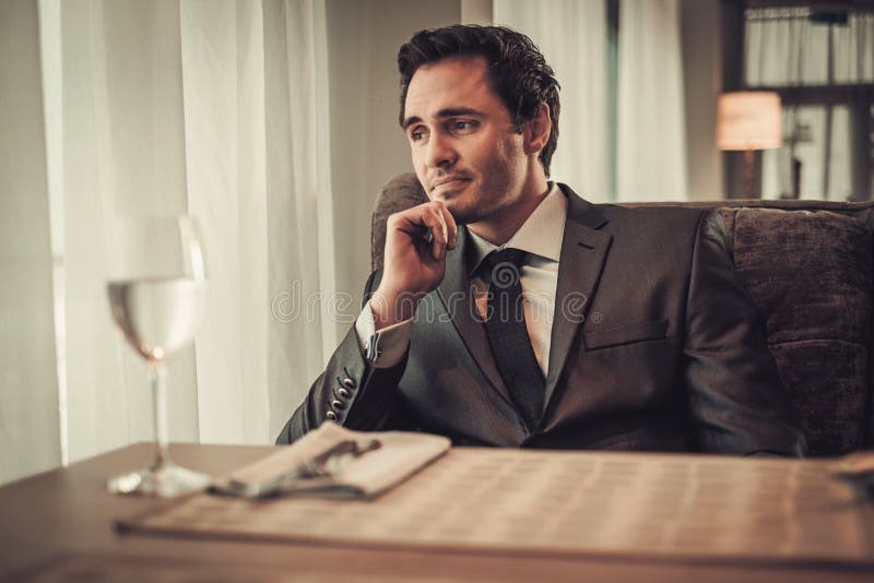 Confident Young Man Sitting in Restaurant Waiting for Somebody. Stock ...