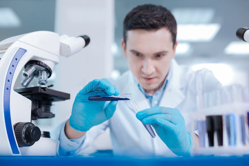 Confident Young Practitioner Doing Analysis Stock Photo - Image of ...