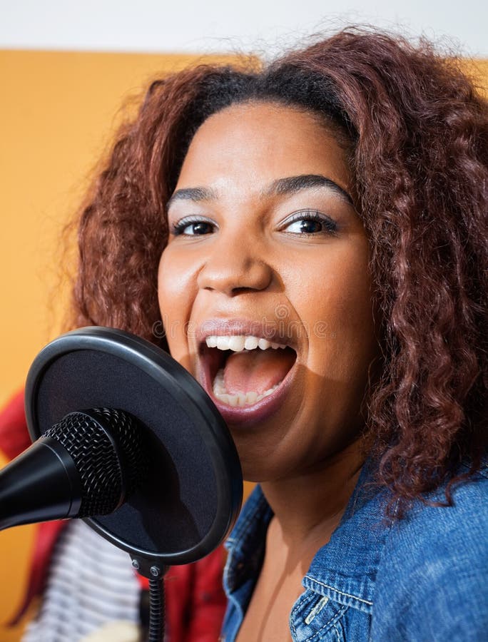 Female Singer Smiling while Performing in Studio Stock Image - Image of ...