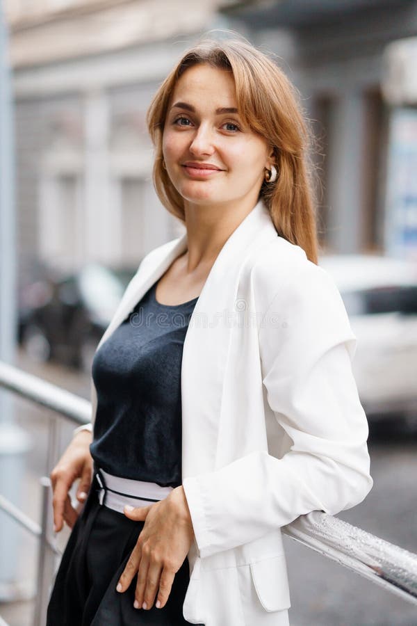 Confident Young Woman in Urban Setting with Stylish Outfit Stock Photo ...